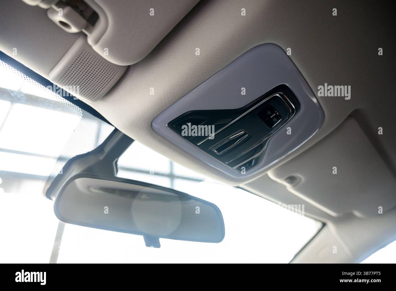 Closeup image of a vehicles overhead control panel showing passenger ...