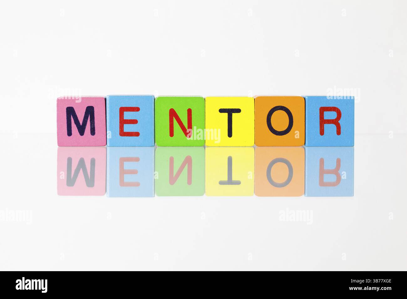 Mentor - an inscription from children's wooden blocks Stock Photo - Alamy