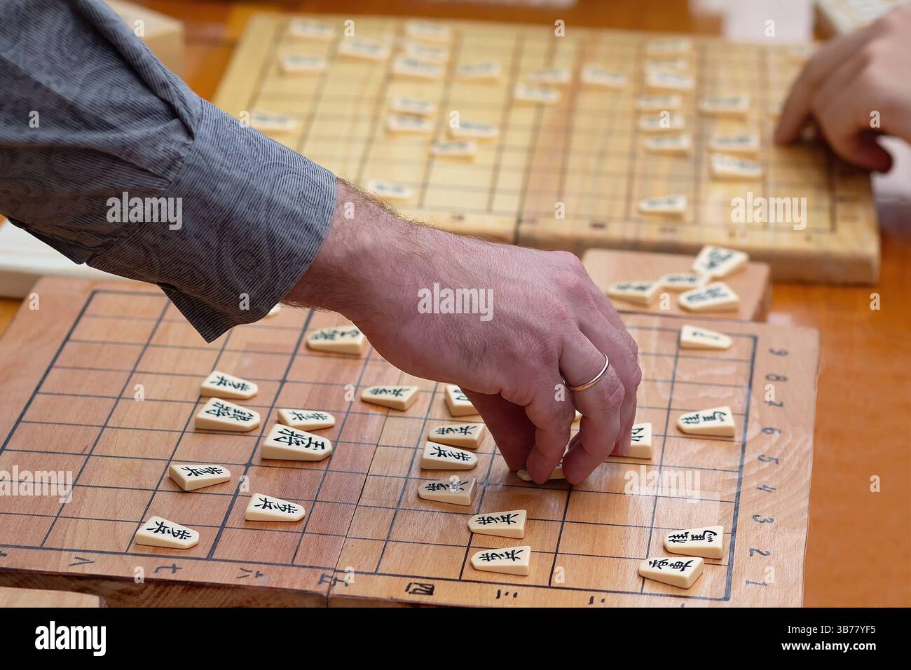People play Japanese chess shogi. Japanese culture Stock Photo - Alamy