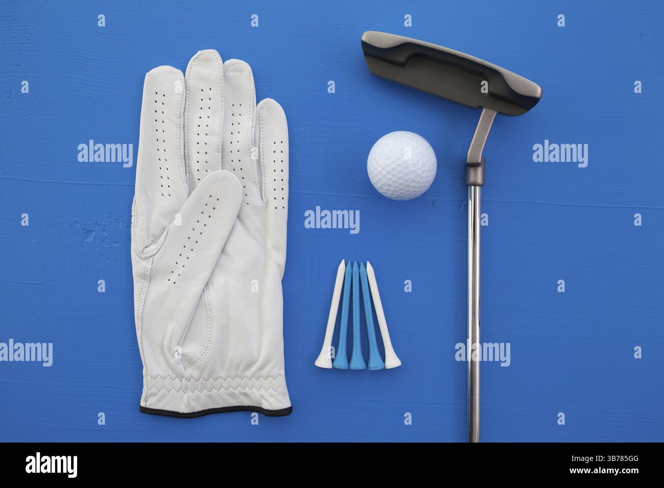 Different golf equipments on the blue desk - flat lay photography Stock ...