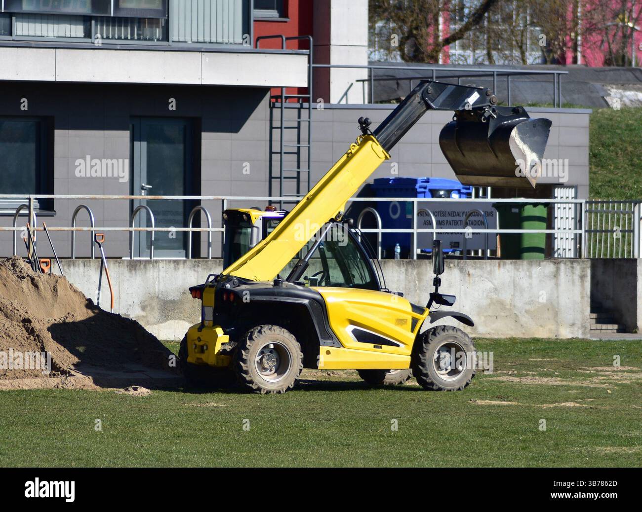 Modern mini yellow excavator hi-res stock photography and images - Alamy
