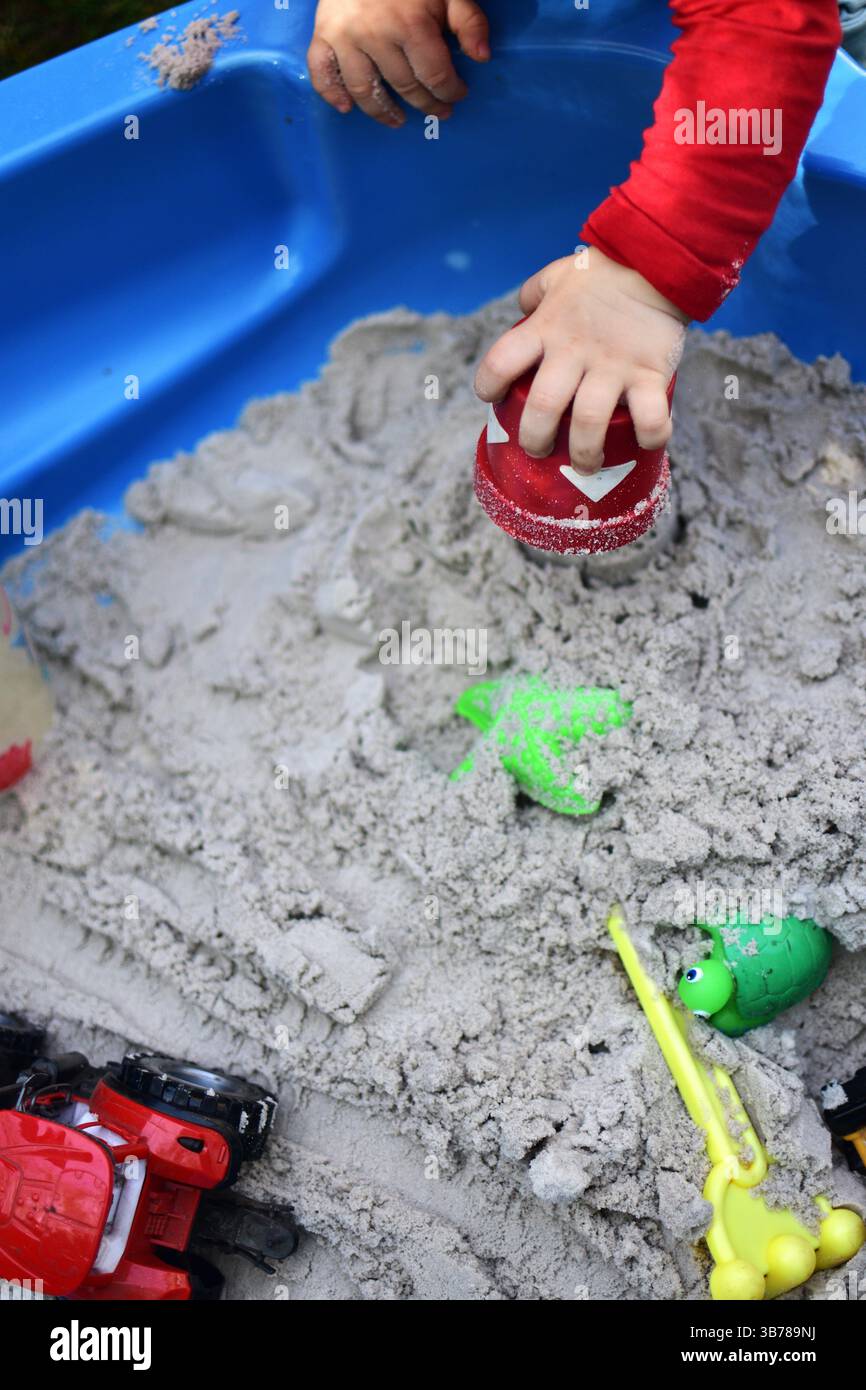 Toddler digging sand hand hi-res stock photography and images - Alamy