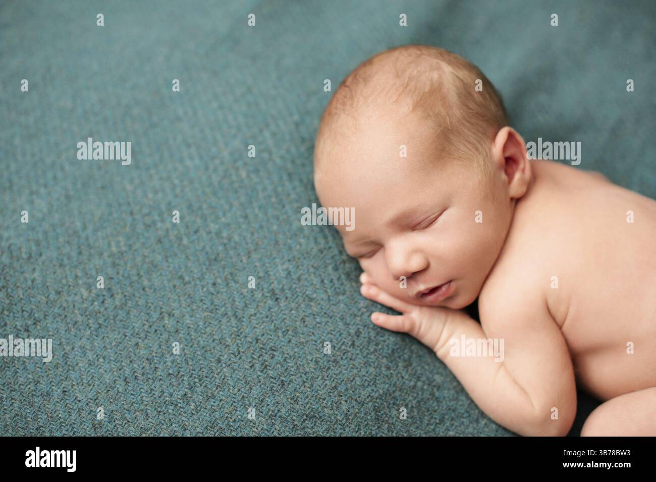 Newborn sleeping on turquoise hi-res stock photography and images - Alamy
