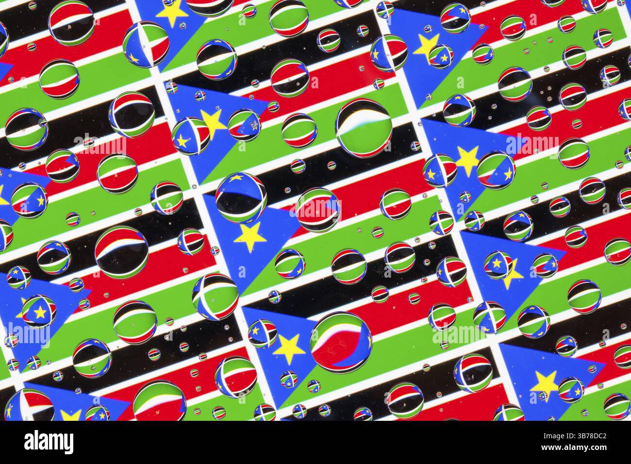 Flags of South Sudan, behind a glass covered with rain drops.Pattern ...