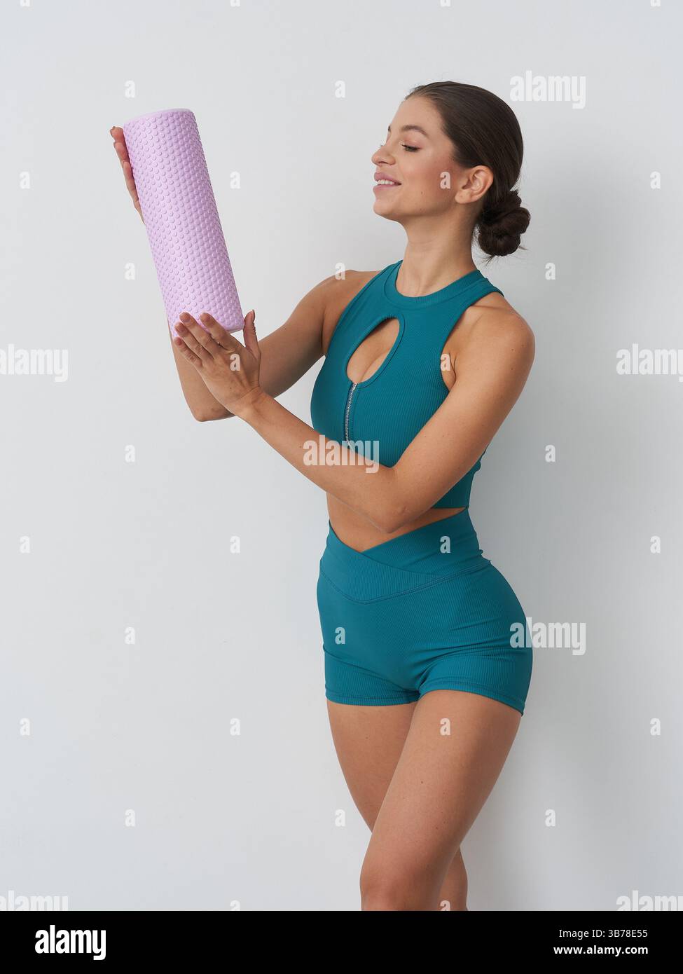Girl using foam roller hi-res stock photography and images - Alamy