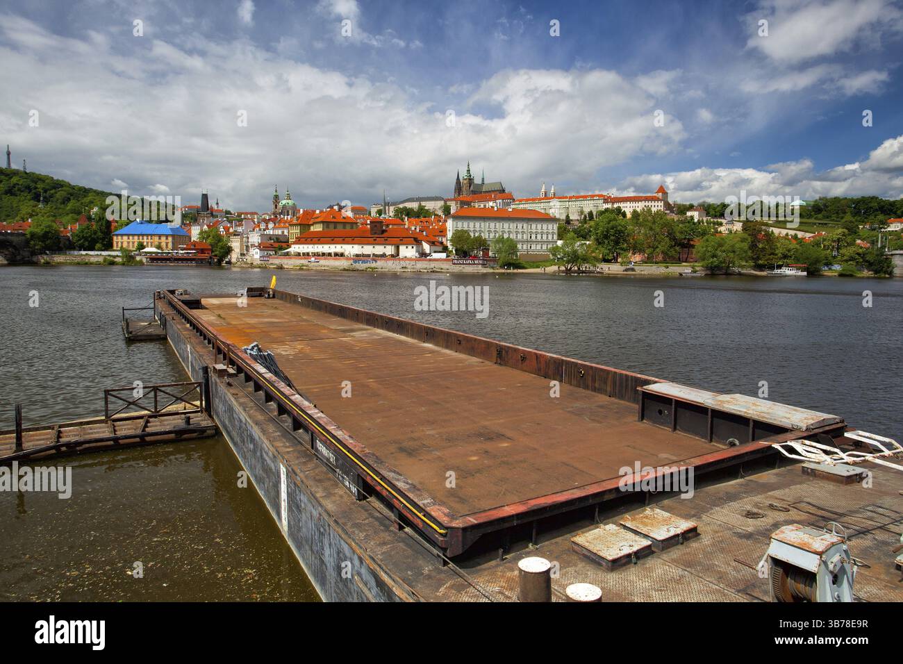 View on the spring Prague gothic Castle and big tugboat, Czech Republic ...