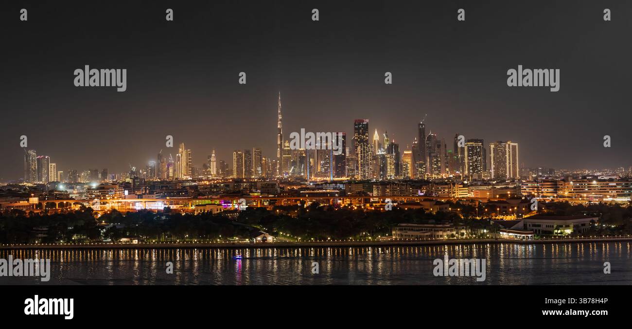 Stunning nighttime view of Dubai's illuminated skyline, featuring ...