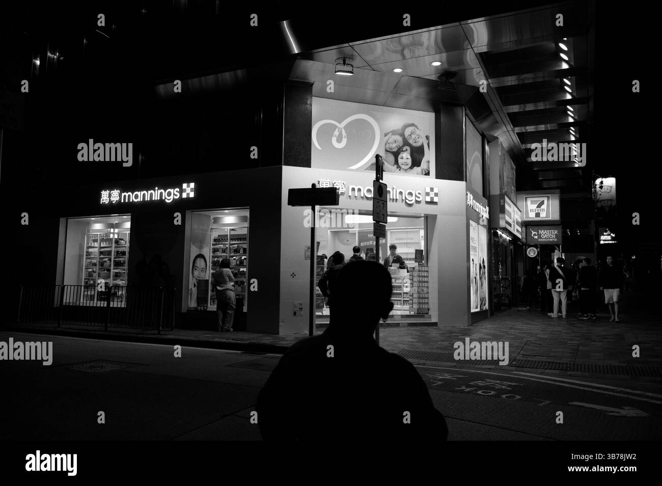 Neon-lit corners of HK where Mannings and 7-Eleven stand as glowing ...