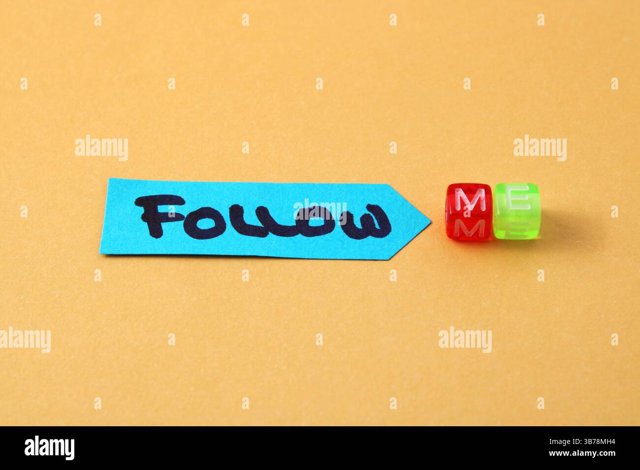 Sticky note with the word FOLLOW ME Stock Photo - Alamy
