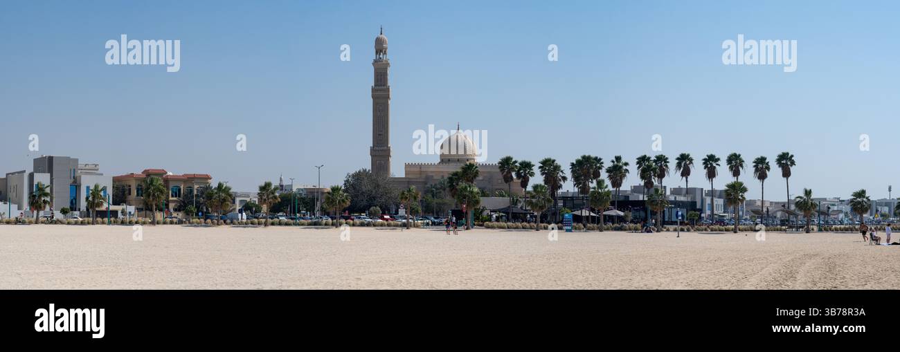 Panoramic view of Dubai featuring a mosque with a prominent dome and ...