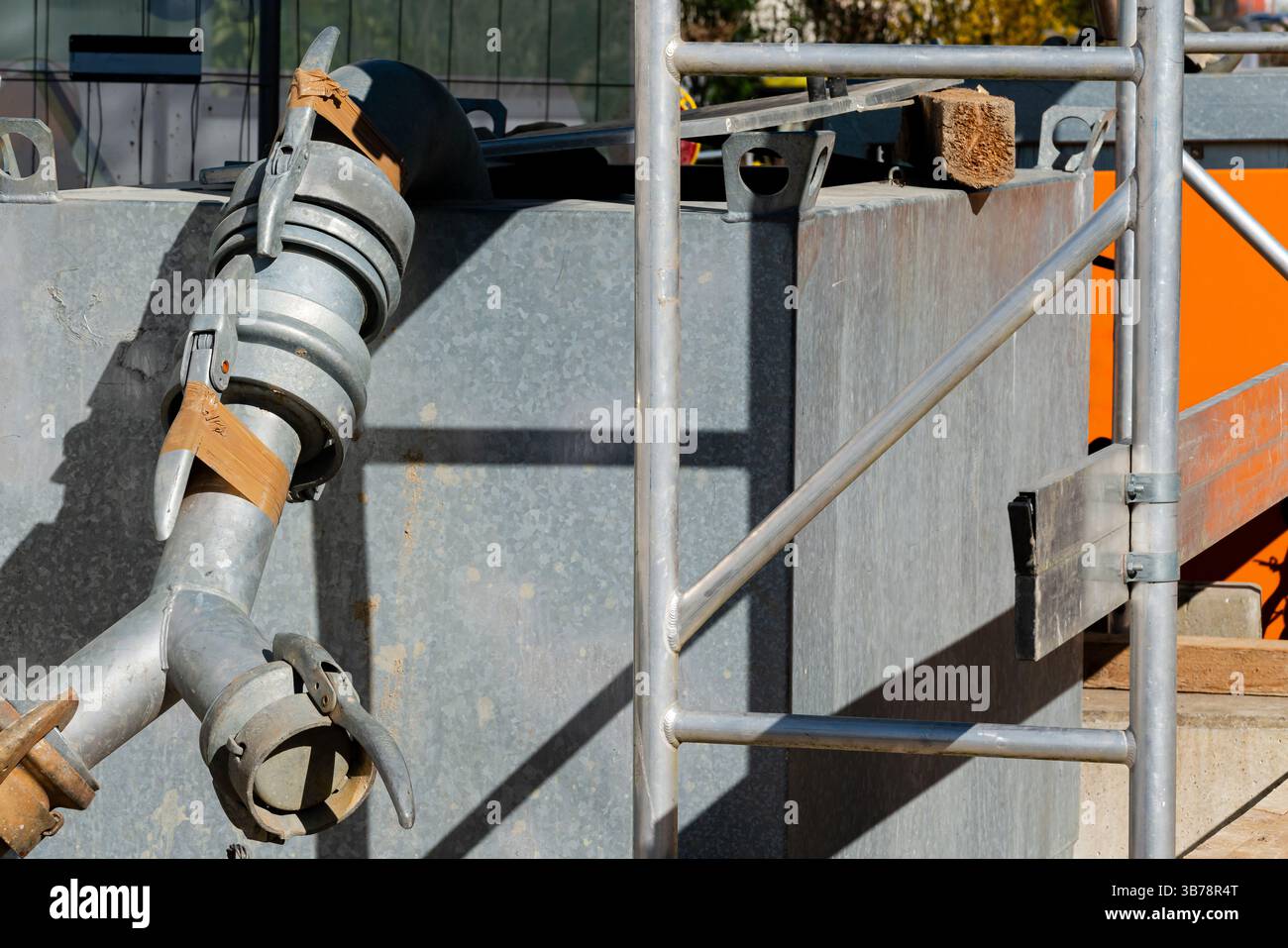 Metal pipes and scaffolding are prominently displayed at a construction ...