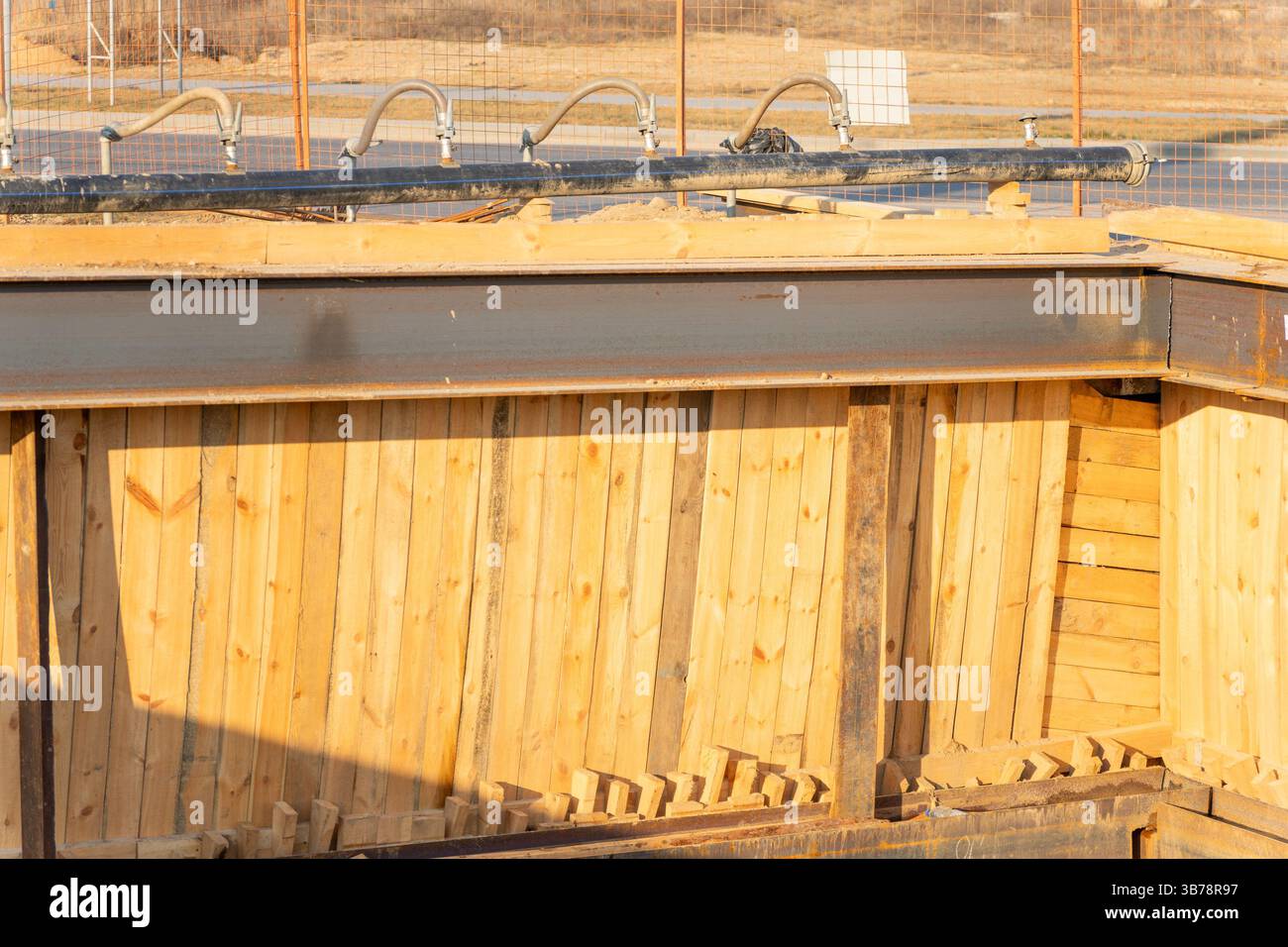 View of a series of flexible hoses connected to a pipe at a ...