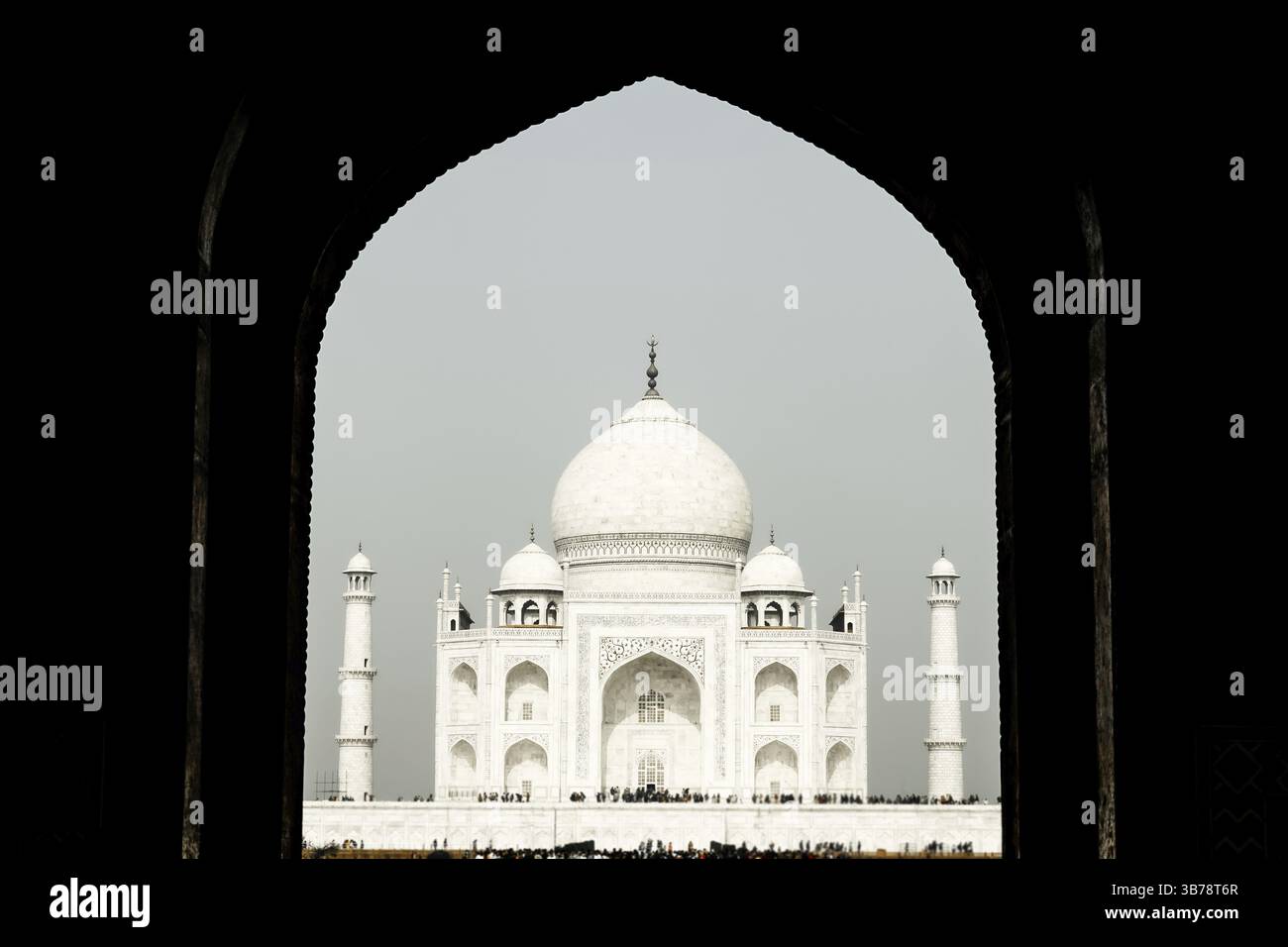 Taj Mahal which is visible from the large tower gate (India, Agra). Shooting Location: India ...