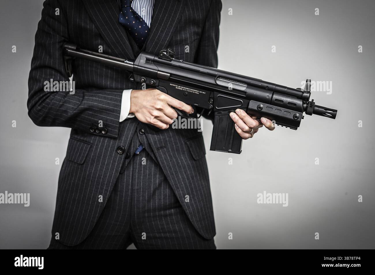 Businessman to fight with a machine gun. Shooting Location: Tokyo ...