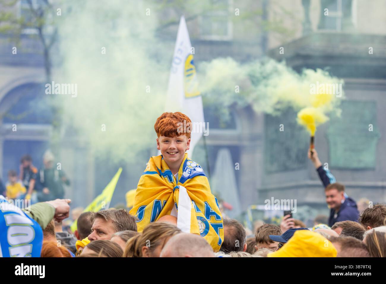 Leeds, UK. 05 MAY, 2025. Boy looks towards the camera as a flare goes ...