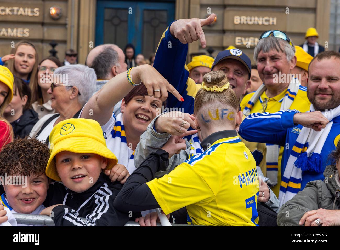 Leeds, UK. 05 MAY, 2025. People point toward a LUFC inspired haircut as ...