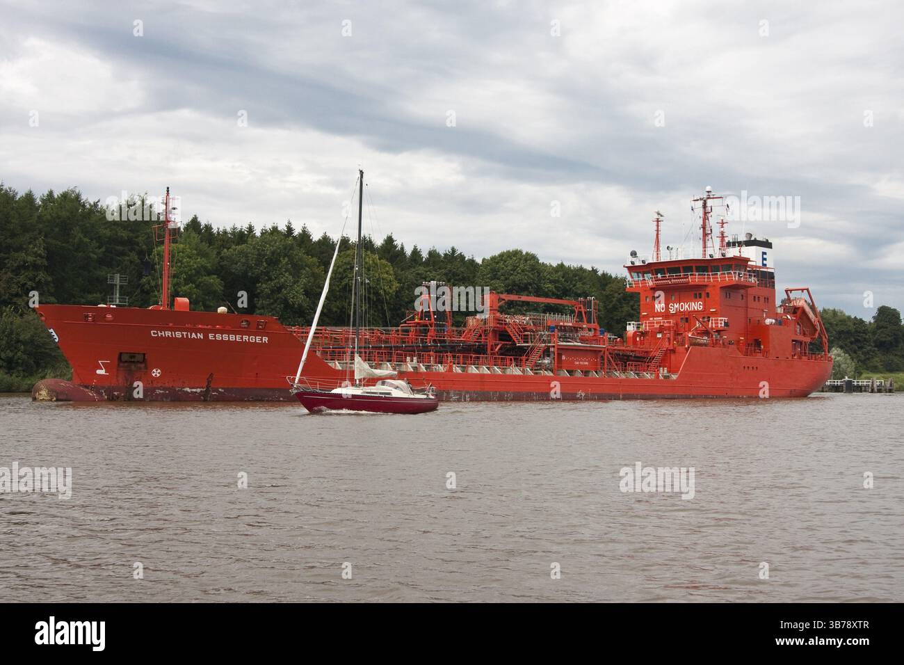 Commercial vessel and leisure boat on the Kiel Canal Stock Photo - Alamy