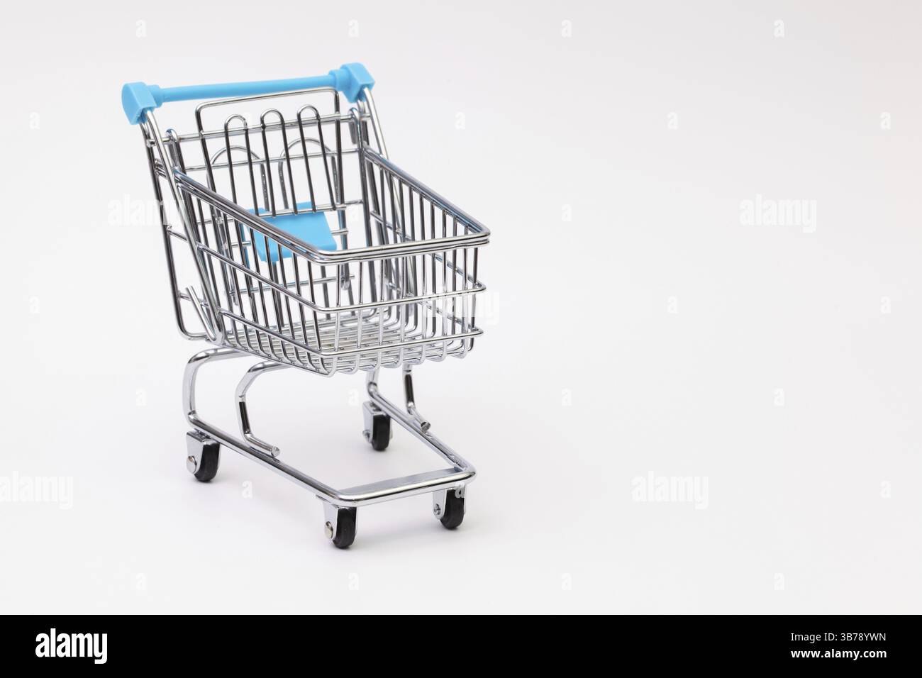 Shopping trolley on the white background Stock Photo - Alamy