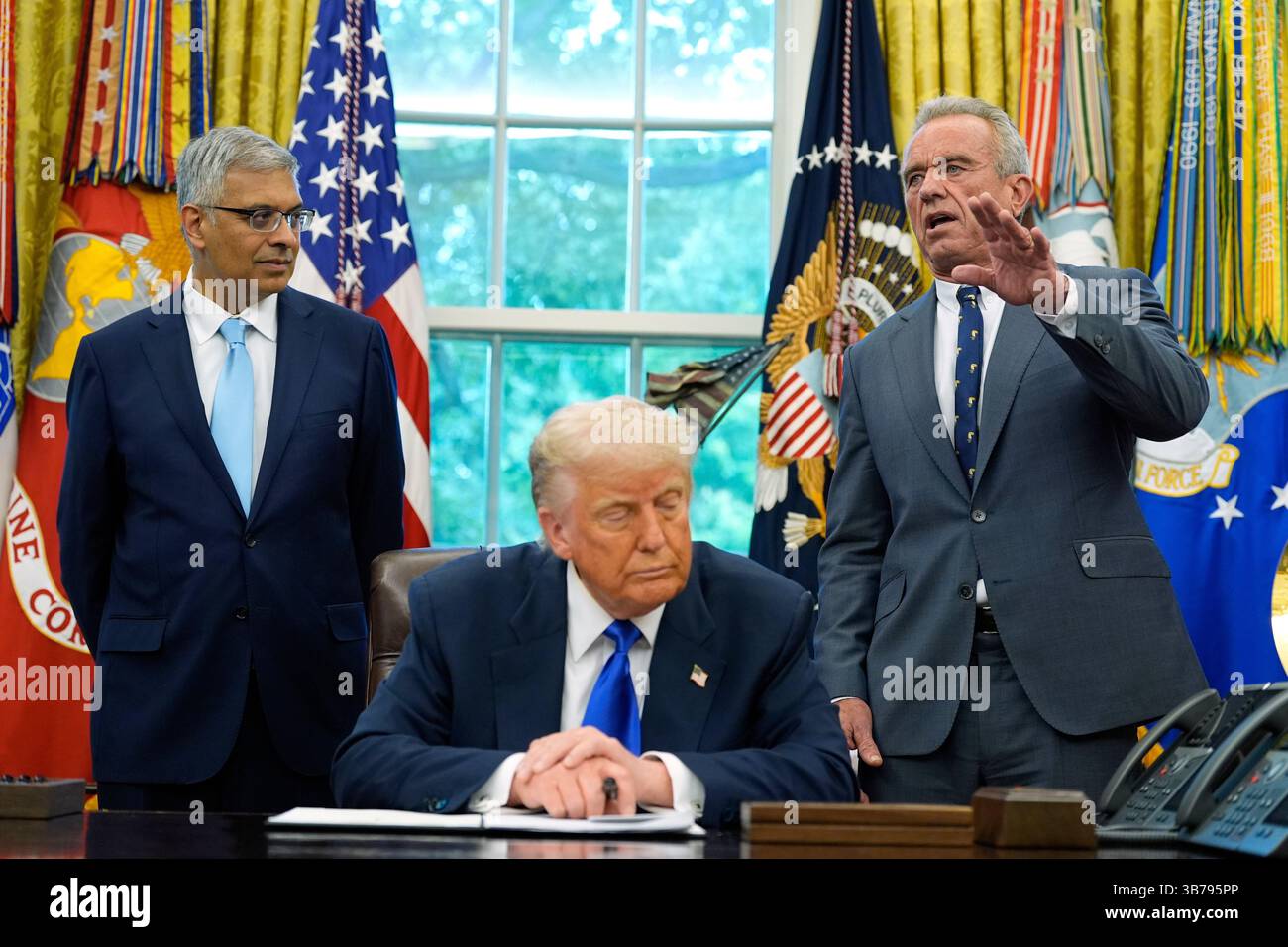 President Donald Trump listens as Health and Human Services Secretary ...