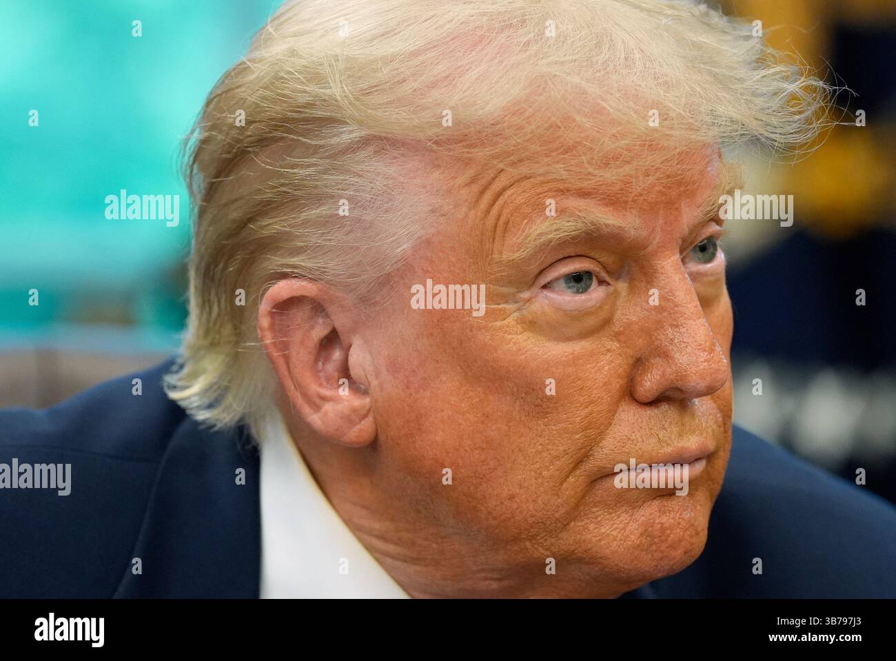 President Donald Trump speaks with reporters as he signs executive ...