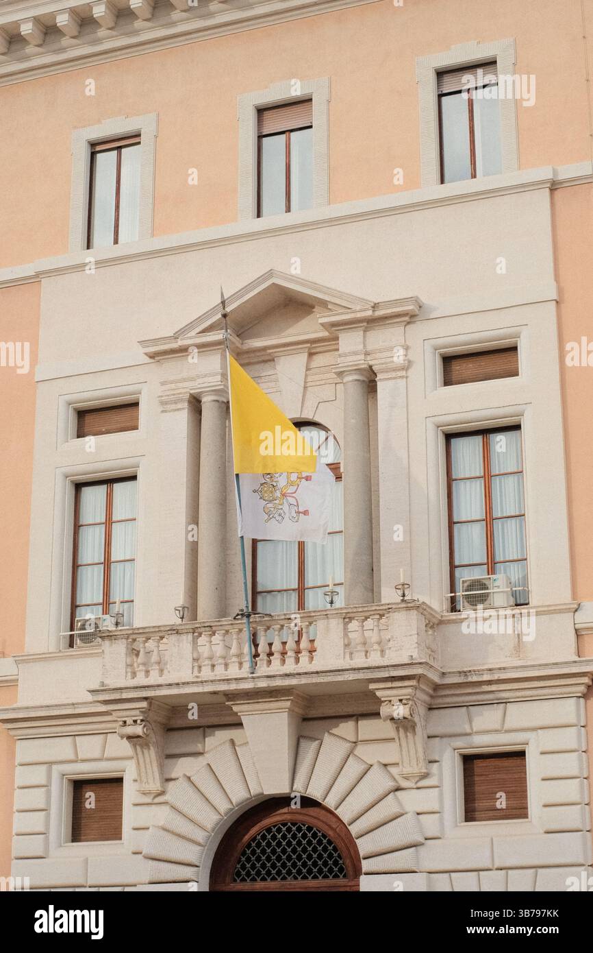 Vatican City flag waving on balcony of official building with ...