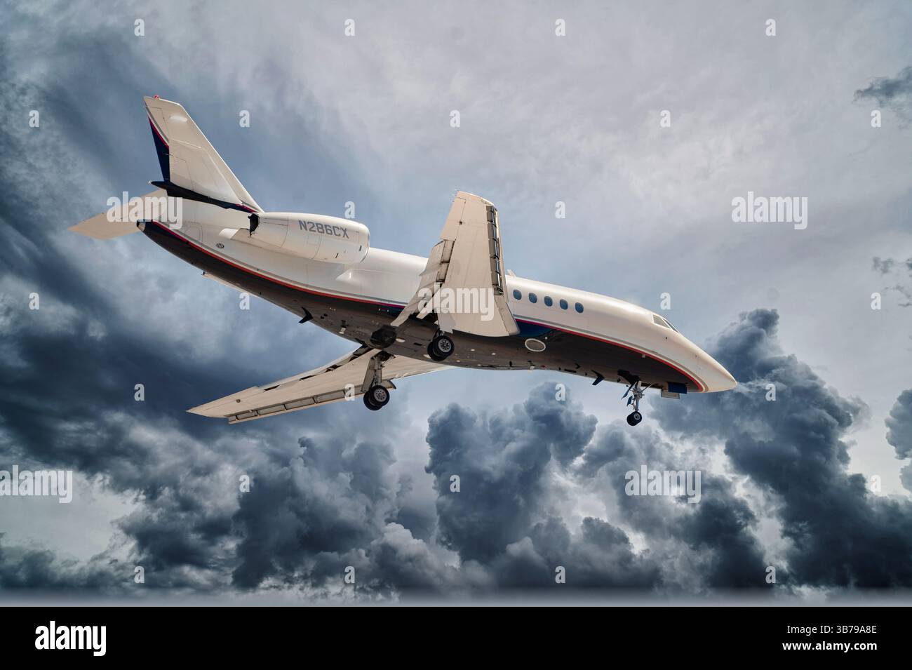 Dassault Falcon 2000 private corporate Jet flying towards and airport ...