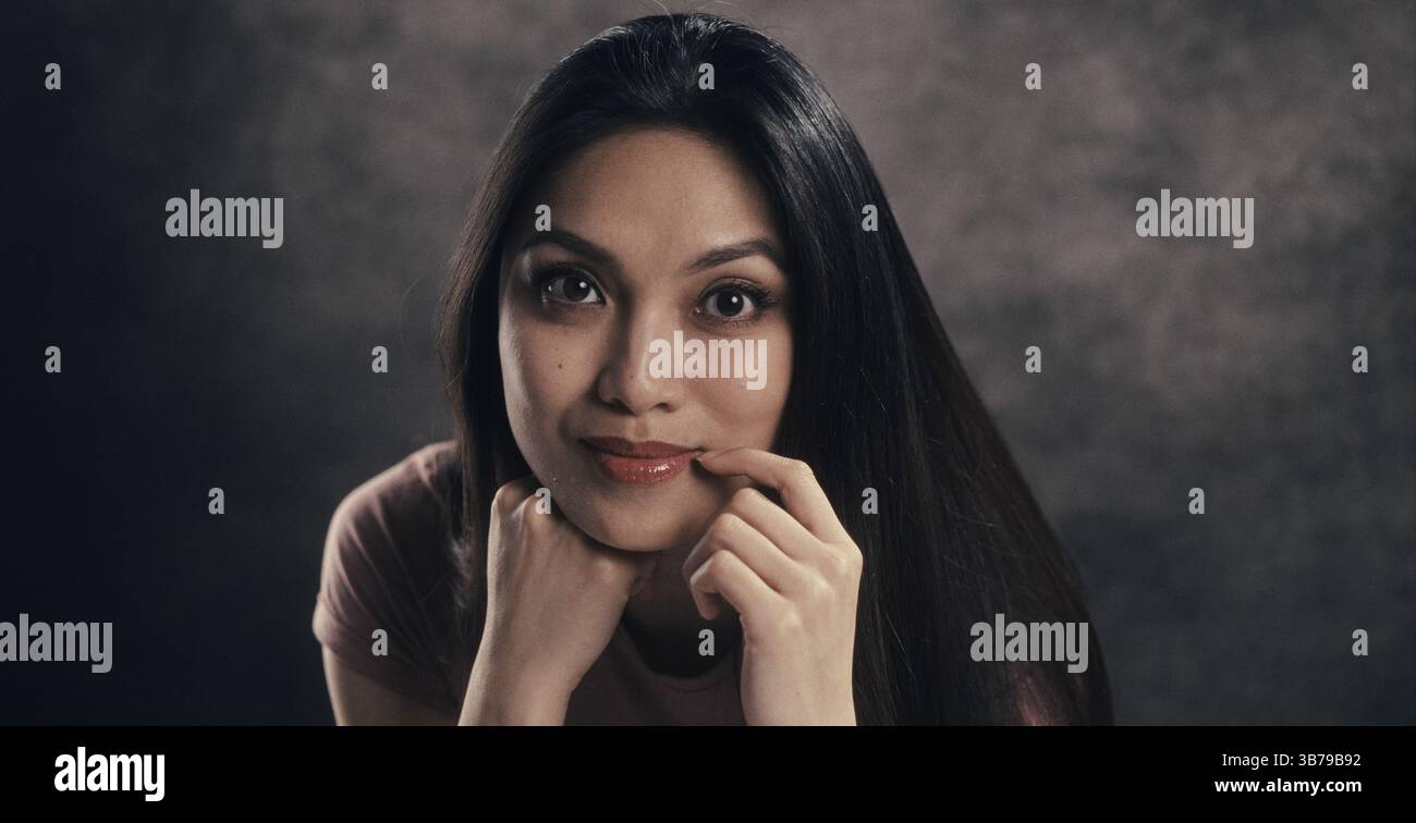 Woman with subtle smile hi-res stock photography and images - Alamy