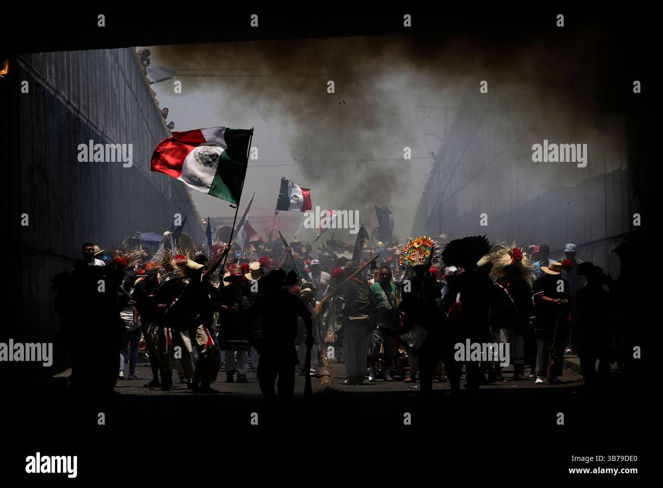 People participate in a reenactment of the Battle of Puebla during a ...