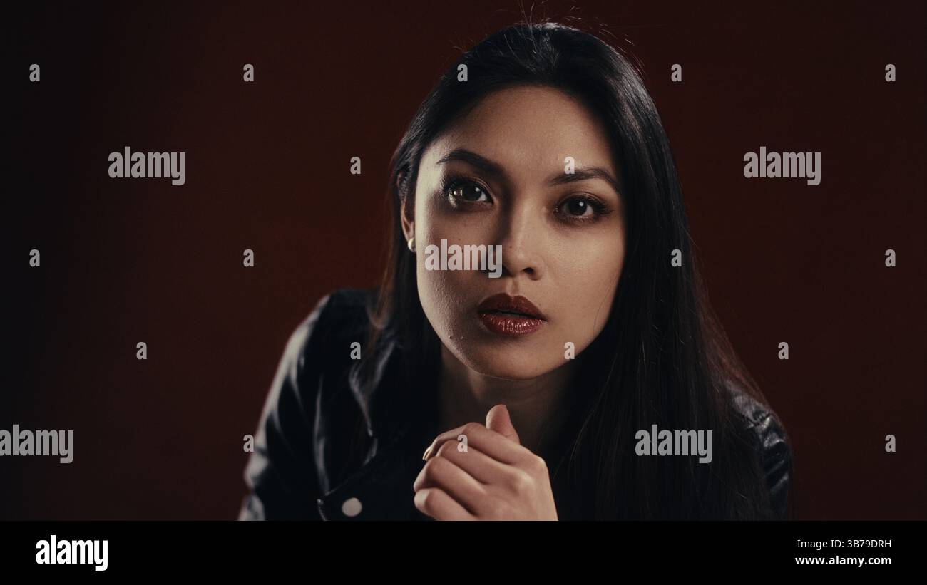 Confident woman dark hair hi-res stock photography and images - Alamy