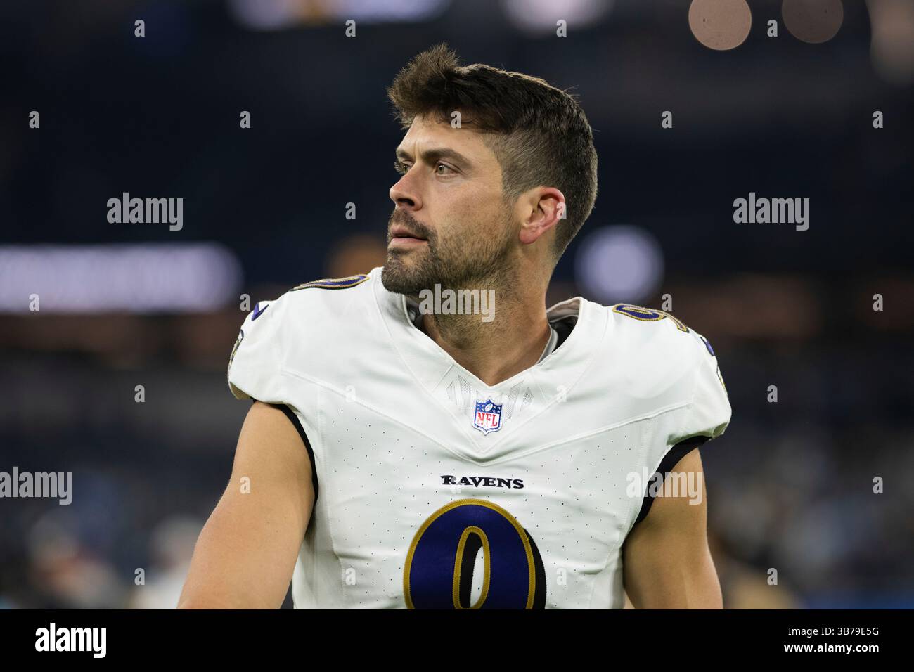 FILE - Baltimore Ravens place kicker Justin Tucker walks back to the ...
