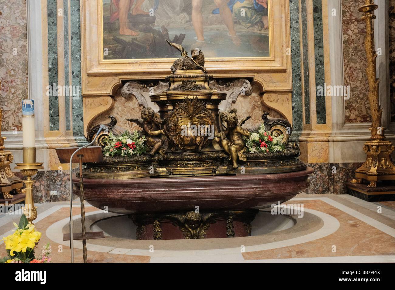 Ornate holy water font in Saint Peters Basilica with sculpted marble ...