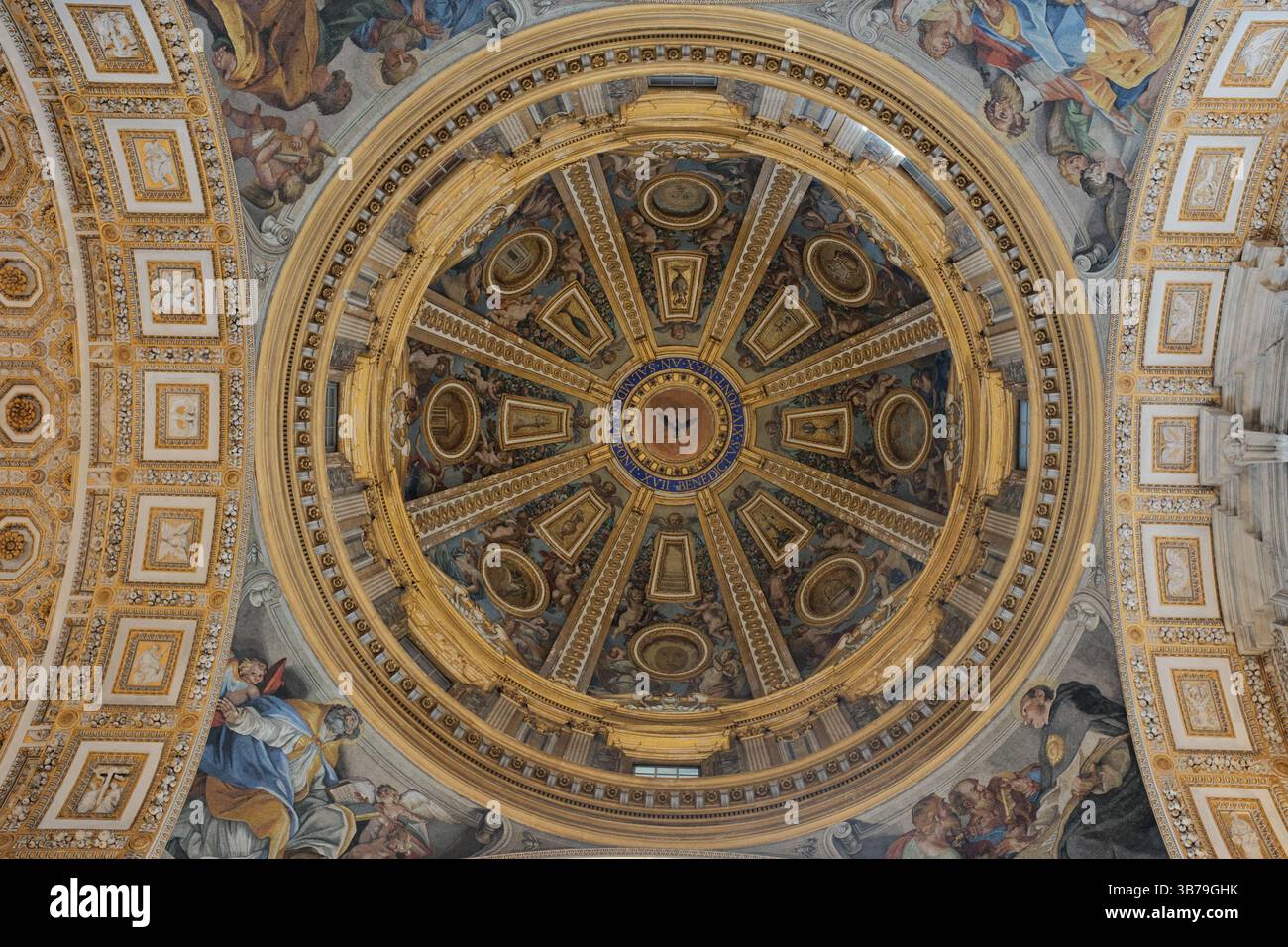 Ornate vaulted ceilings and central dome of Saint Peters Basilica in ...