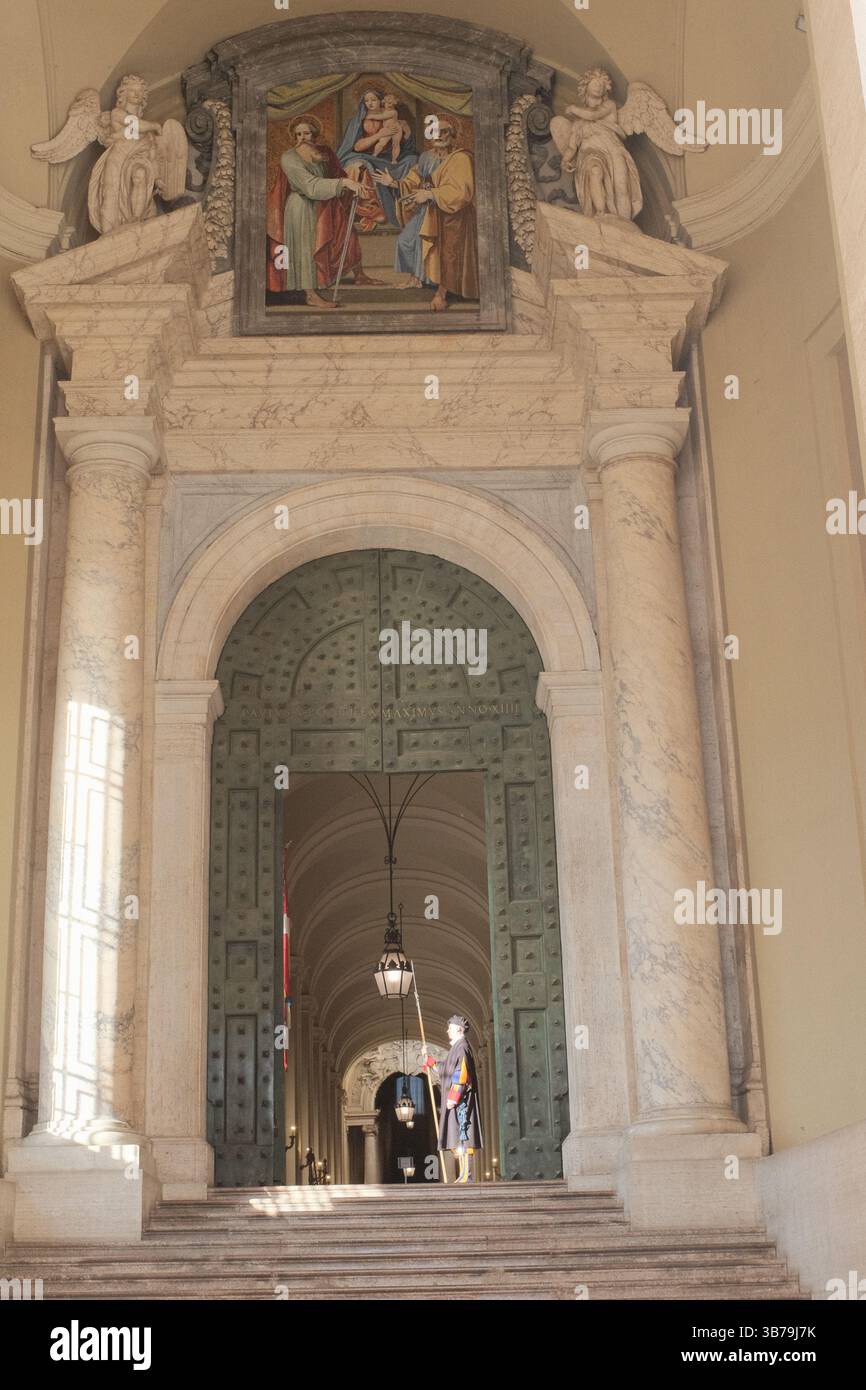 Swiss Guard in traditional Renaissance uniform holding ceremonial ...