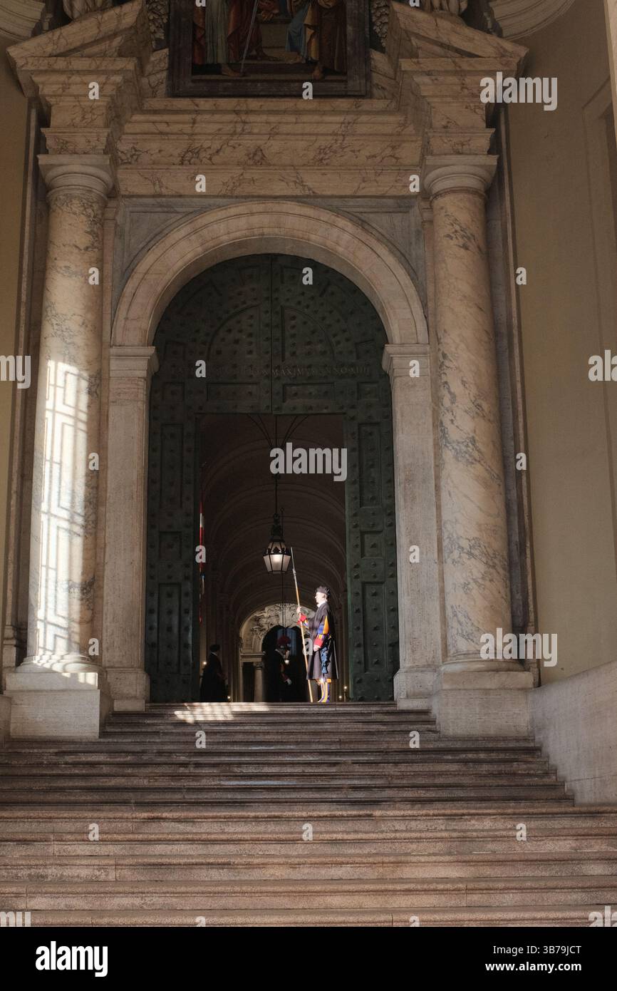 Swiss Guard in traditional Renaissance uniform holding ceremonial ...