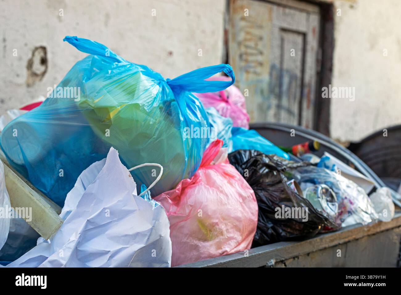 decomposing garbage bags with garbage in a garbage can. Environment ...