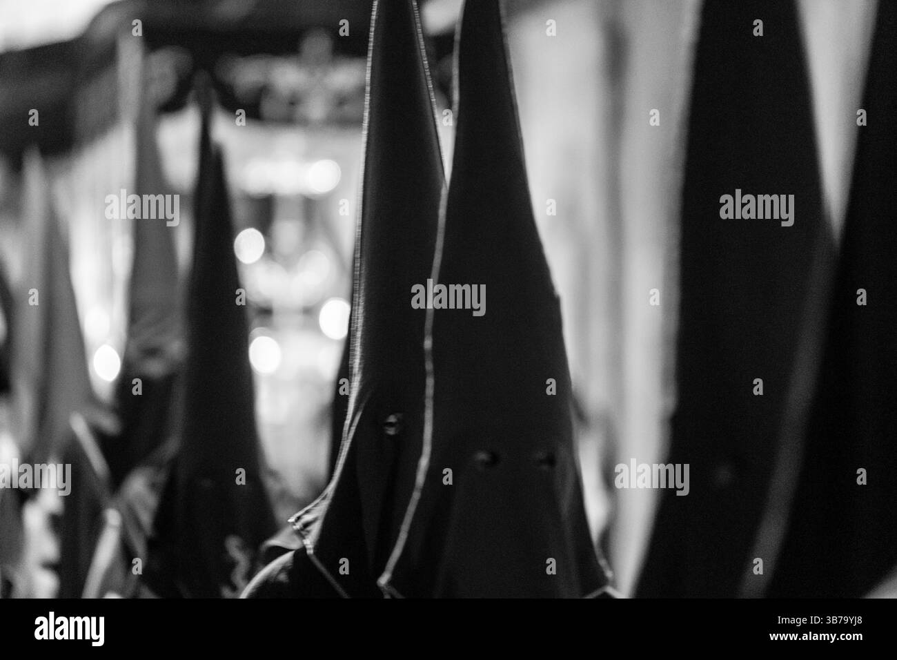 Hooded brothers with conical hats that serve as masks, Holy Week ...
