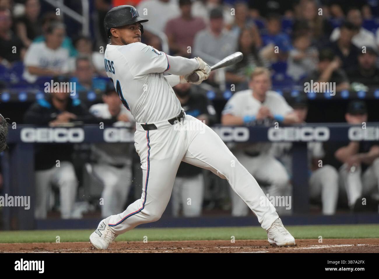 Miami Marlins' Dane Myers hits a single to left field during the second ...