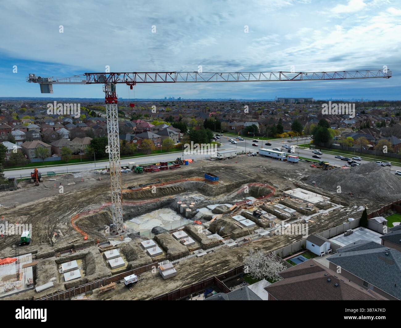 Multi storey building rising in suburban neighbourhood, highlighting ...