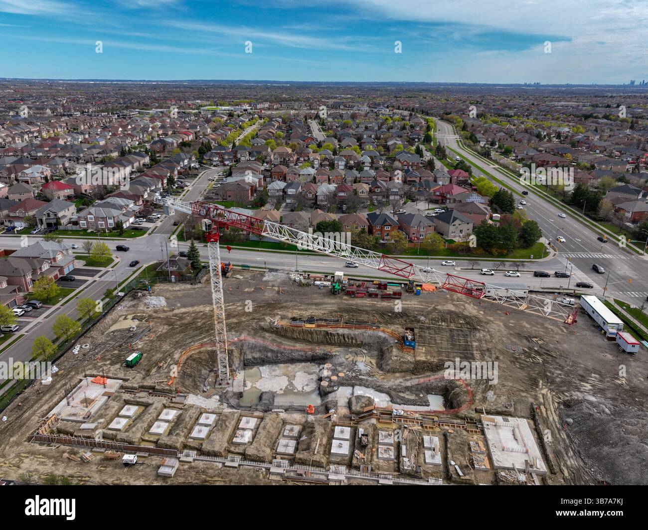 Multi storey building rising in suburban neighbourhood, highlighting ...