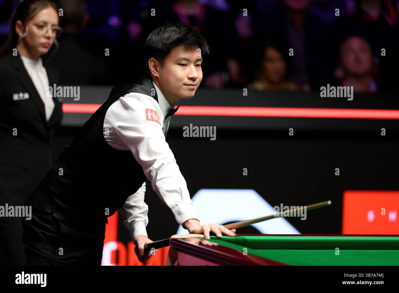 Sheffield, Britain. 5th May, 2025. Zhao Xintong reacts during the final ...