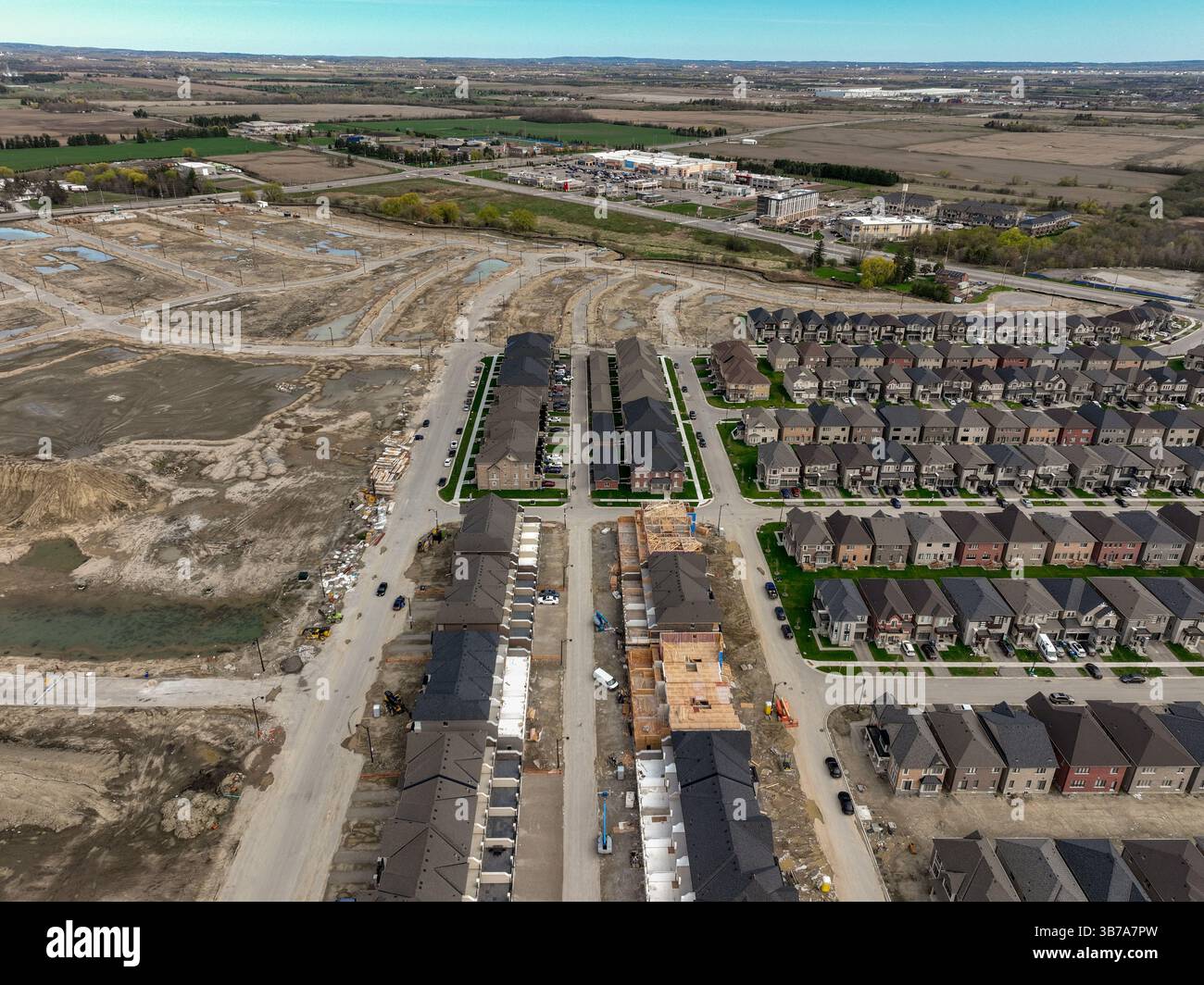 Aerial view of new housing development on the urban fringe of Brampton, Ontario, showing ...