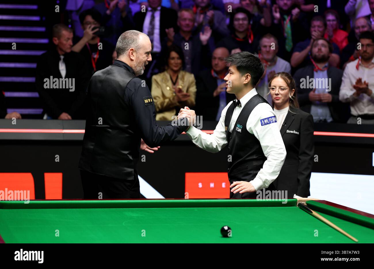 Sheffield, Britain. 5th May, 2025. Zhao Xintong (front R) of China ...