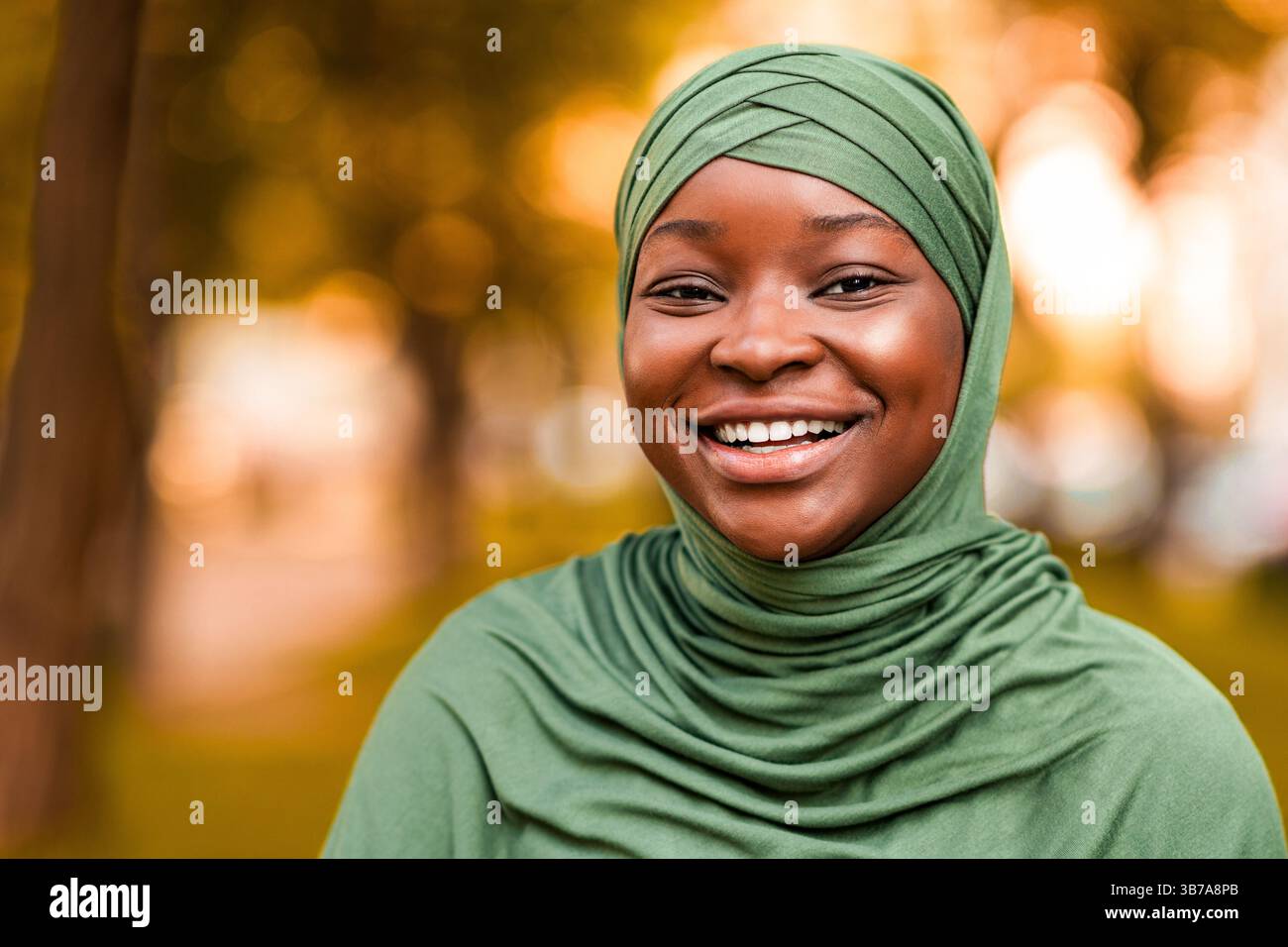 Outdoor Portrait Of Cheerful African Muslim Lady In Hijab Stock Photo ...