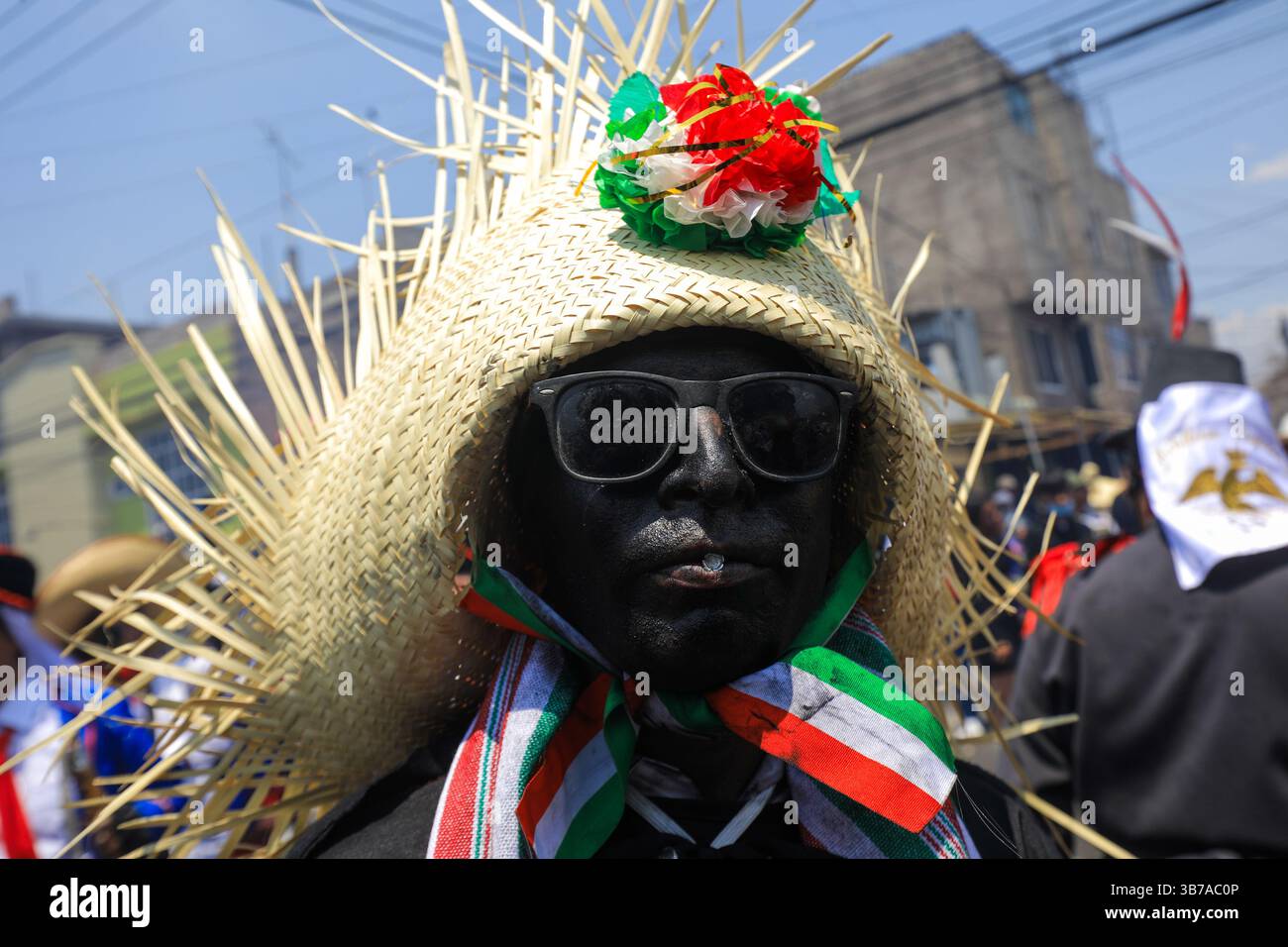 A person disguised as Zacapuaxtla stages the Battle of Puebla, in the ...