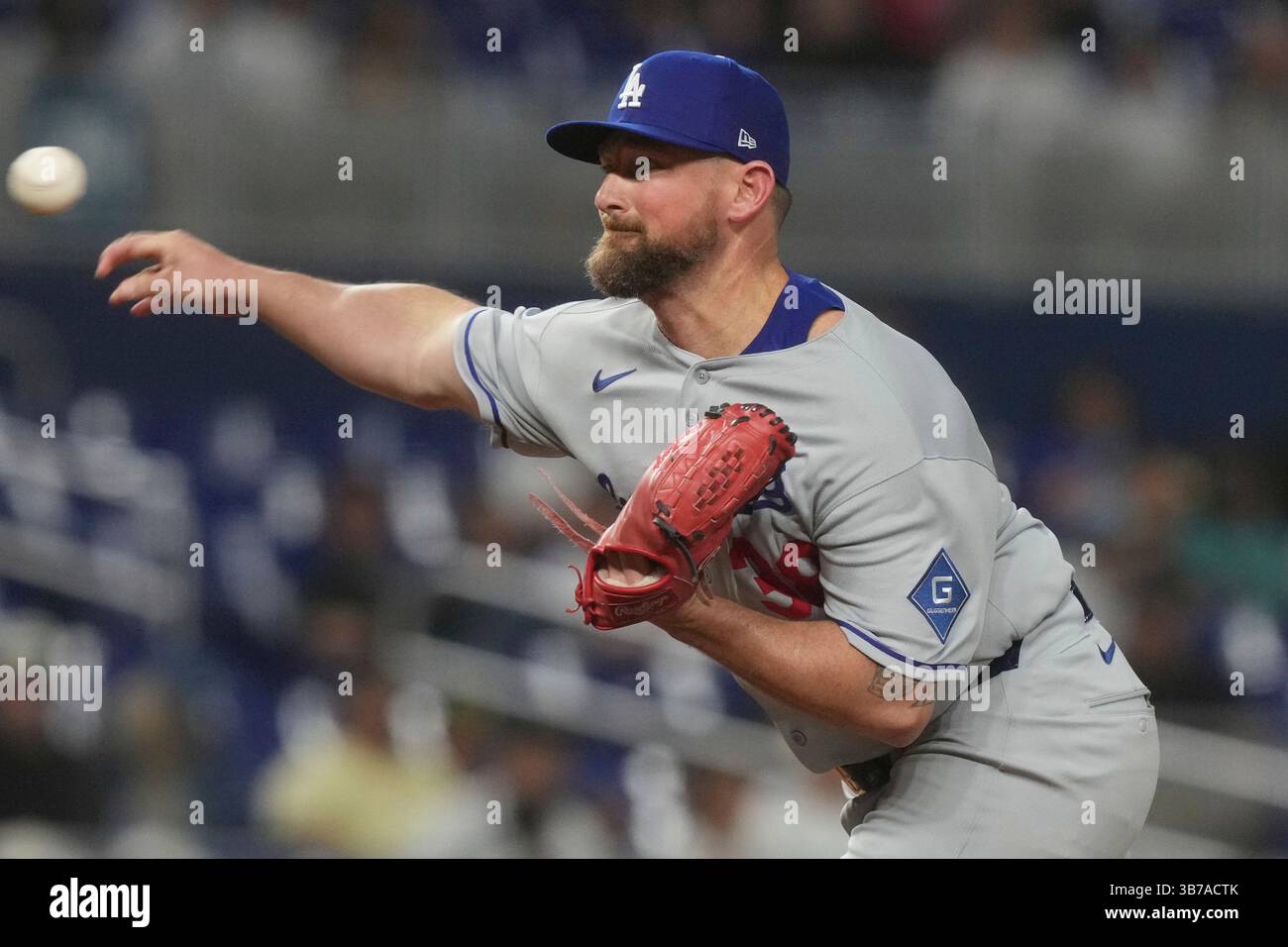 Los Angeles Dodgers pitcher Kirby Yates (38) aims a pitch during the ...
