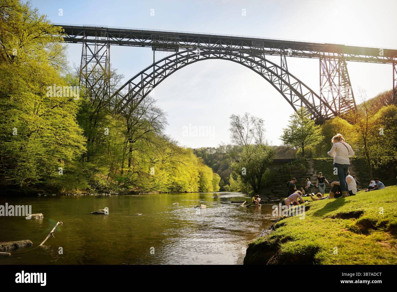 Families enjoy a sunny spring day below the Müngsten Bridge (formerly ...