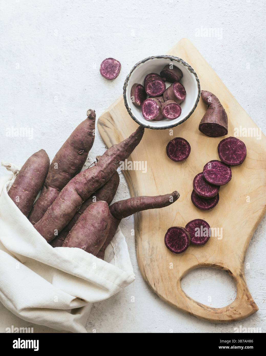 Purple sweet potatoes, whole and sliced Stock Photo - Alamy