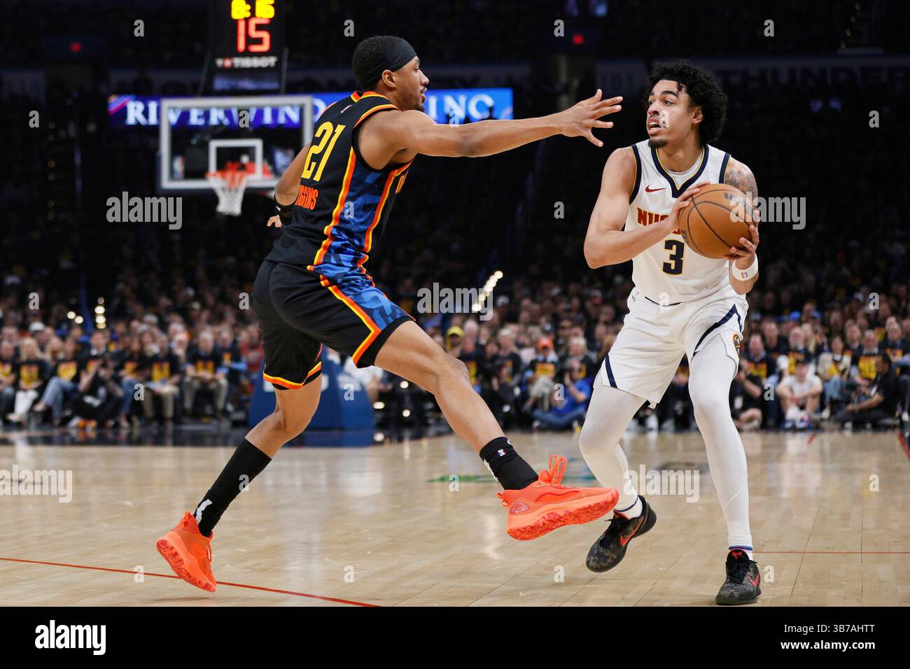 Denver Nuggets guard Julian Strawther (3) looks to make a pass as Oklahoma City Thunder's Aaron ...