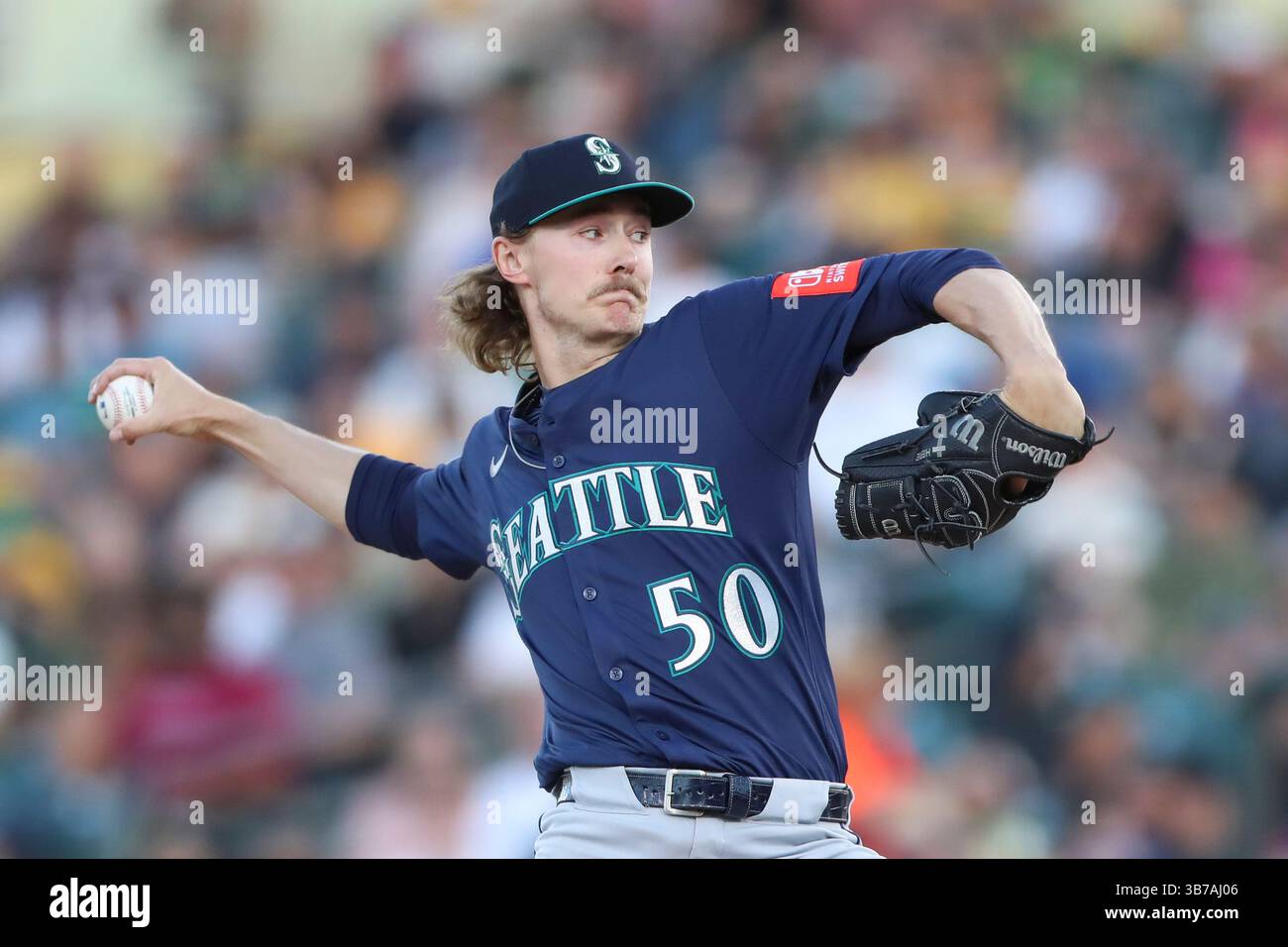 Seattle Mariners pitcher Bryce Miller throws to an Athletics batter ...