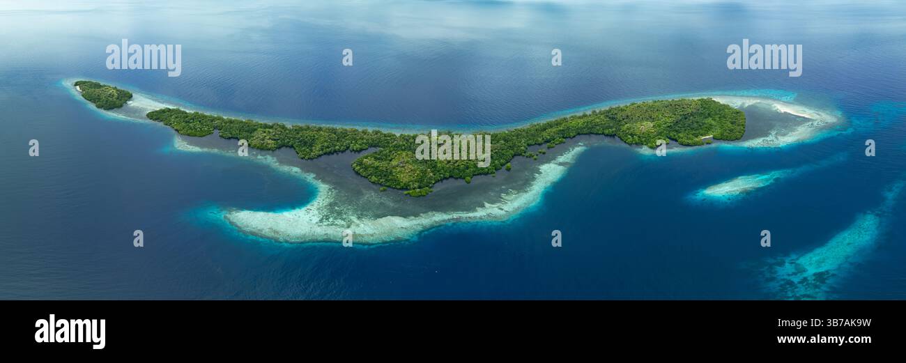 Healthy coral reefs fringe the idyllic islands of Garacie, near ...